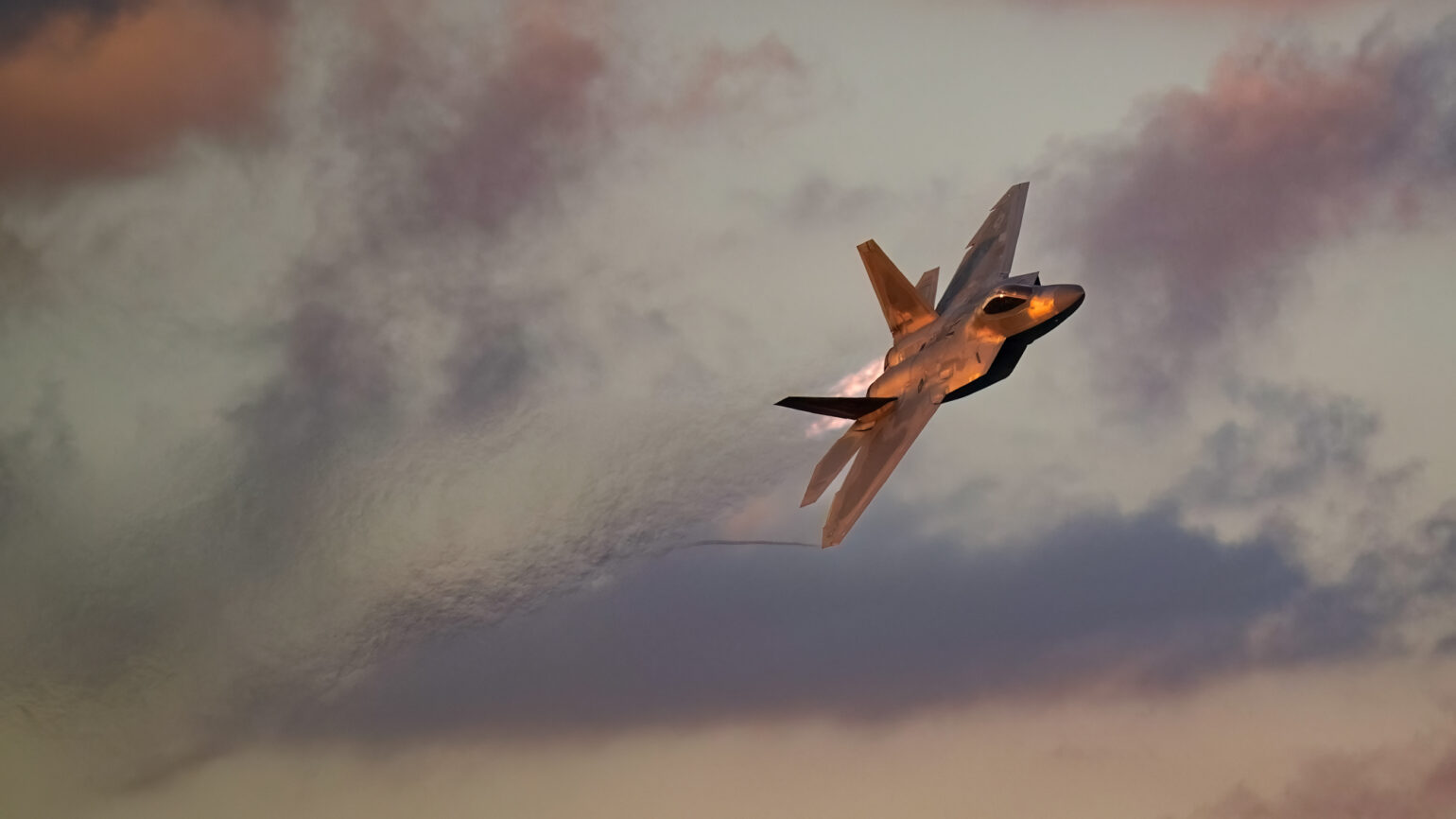 An F22 jet makes high speed passes in front of the air show crow ...